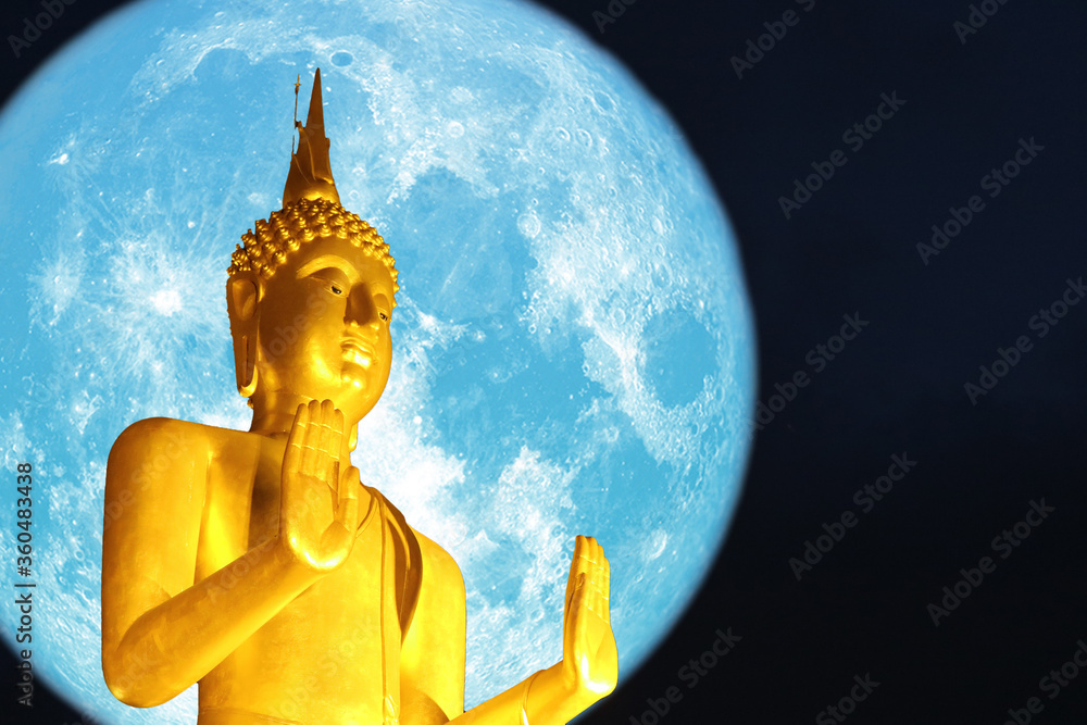 Buddha pacifying the ocean and super blue moon on night sky in the ...