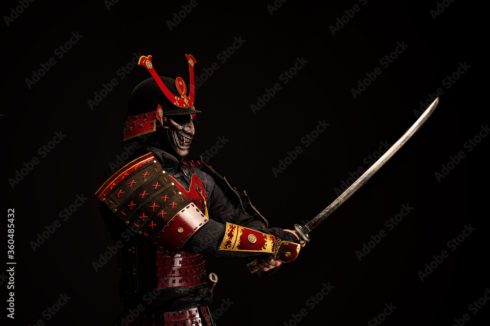 Portrait of a samurai in armor in attack position ภาพถ่ายสต็อก | Adobe ...