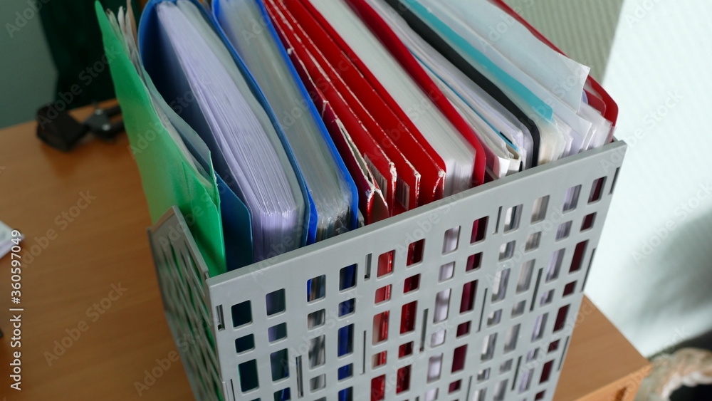 on the table in the tray folders with papers фотография Stock | Adobe Stock