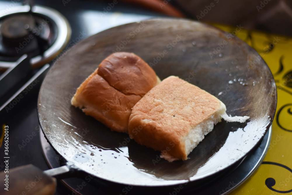 woman making a Indian traditional pao bhaji at home, Indian Food Stock ...