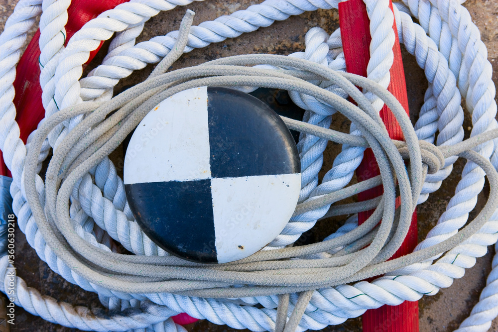Sailing ropes around capstan on the Quayside, Tenby Pembrokeshire Wales ...