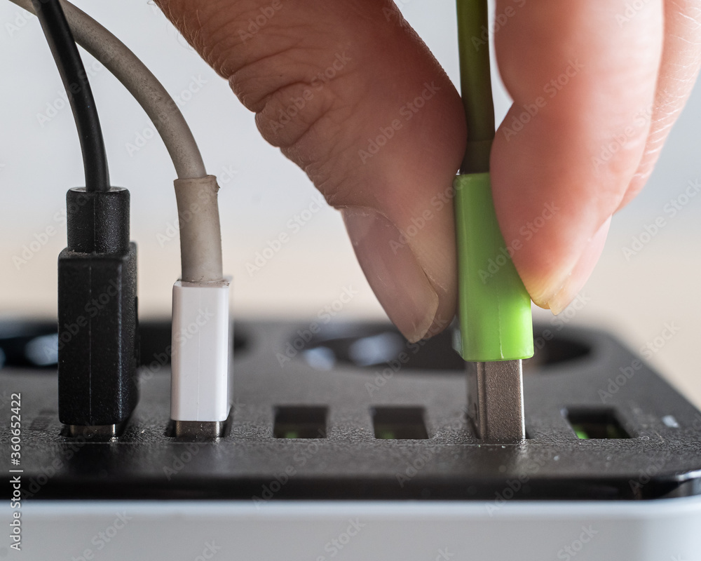 Modern convenient multi-port usb charger for devices. Close-up of a ...