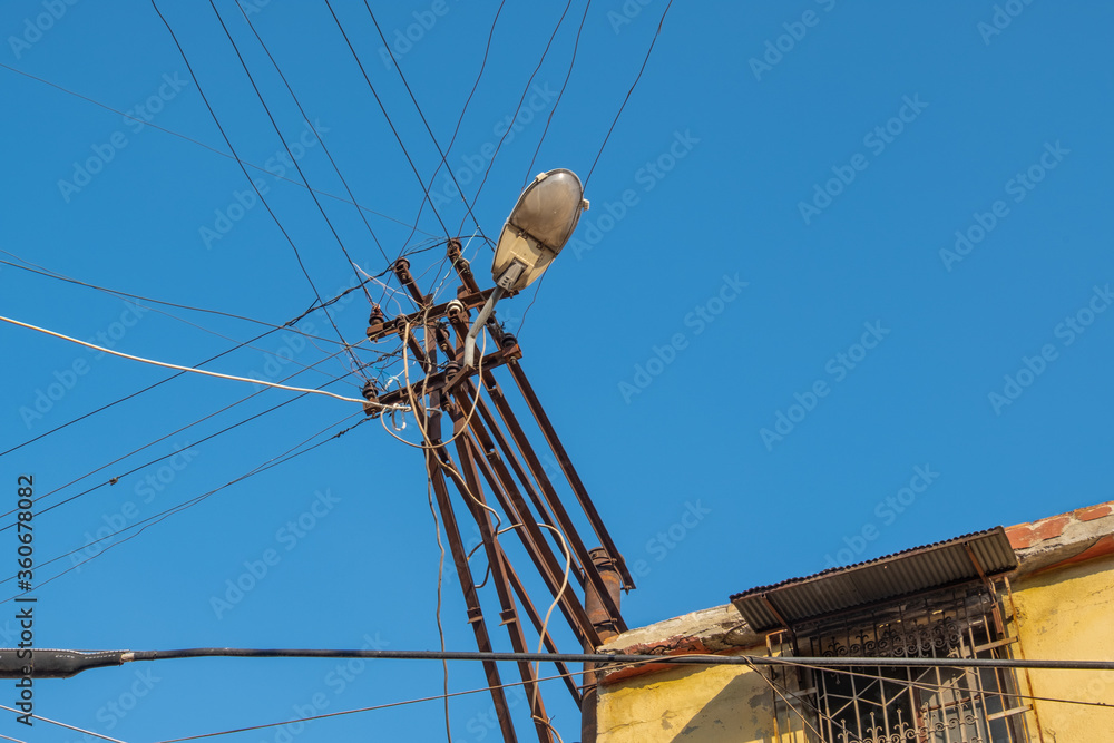 cable clutter on electric pole and street lamp Stock Photo | Adobe Stock