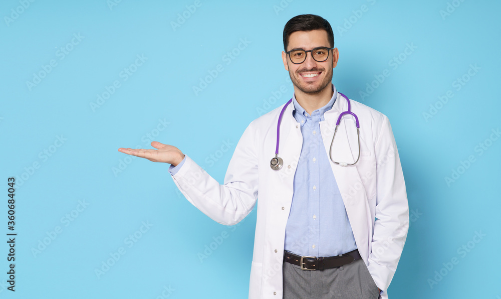 Horizontal banner of smiling young male doctor standing in medical robe ...