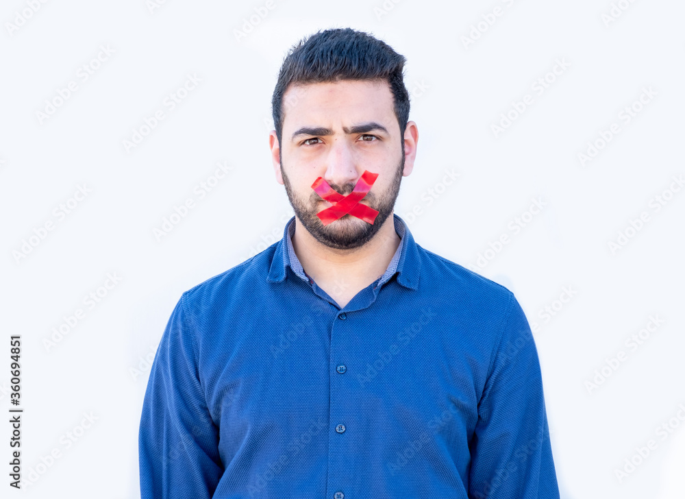 Arabic guy duct taping his mouth symbol for being mute Stock Photo ...