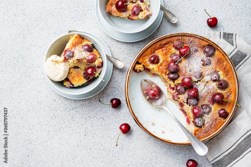 Traditional french pie clafoutis with cherry served with ice cream. top ...