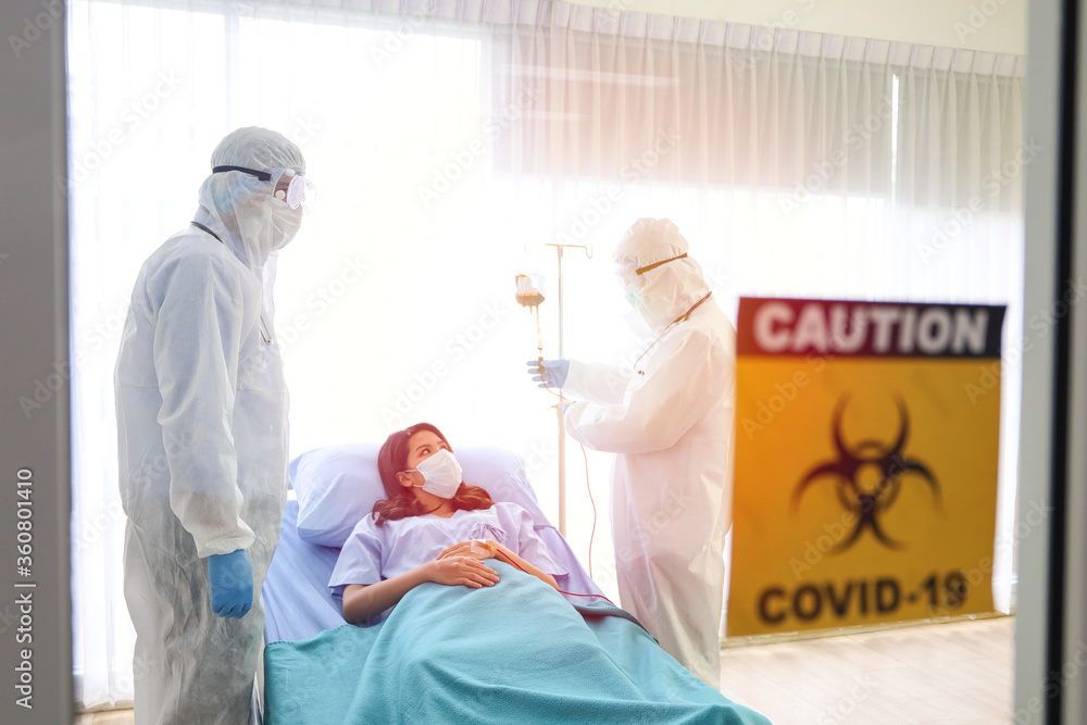A patient woman wear face mask and cure on bed and covid-19 emergency ...