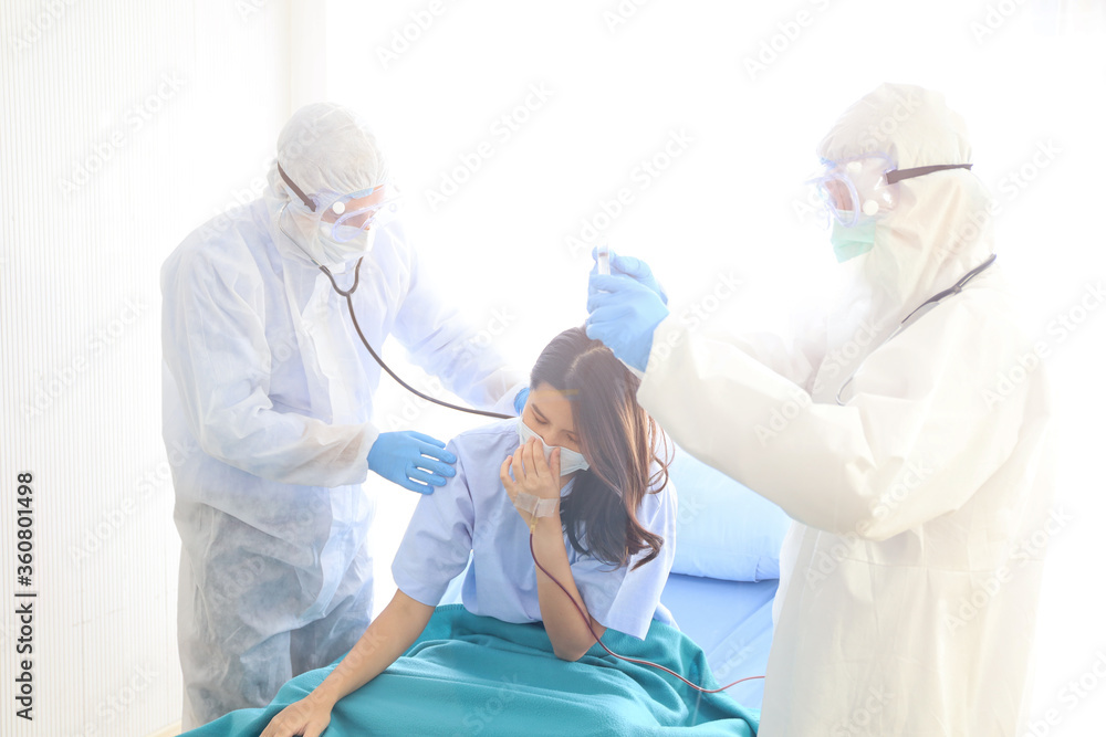 A patient woman wear face mask and cure on bed and covid-19 emergency ...