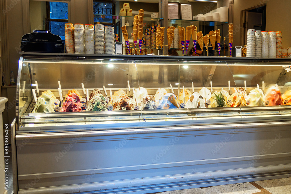 Italian ice-cream shop. Counter with different varieties of ice cream ...