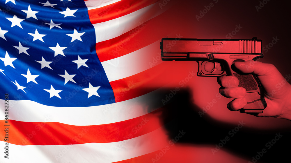 Hand with a gun on a red background. Man with guns near the USA flag ...