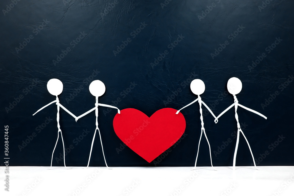 Human stick figures holding hands with a big red heart in dark ...