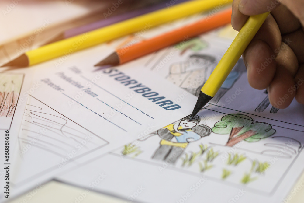 Designer drawing Story board movie video layout for pre-production ...