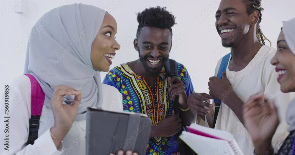 group of happy african students having conversation and team meeting ...