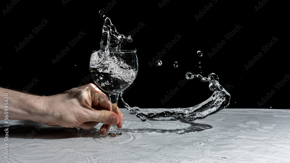 Foto de Water Splash in a Wine Glass on a Table. Water Frozen Action ...