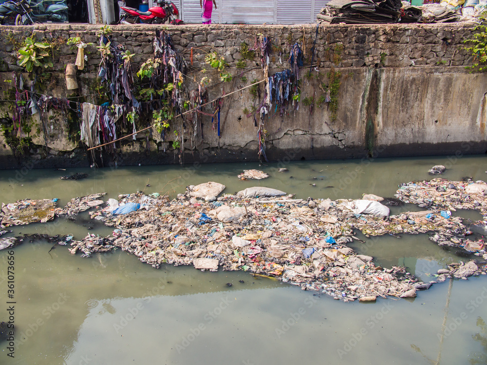Dirty river in Dharavi slums. Mumbai. India. Stock Photo | Adobe Stock