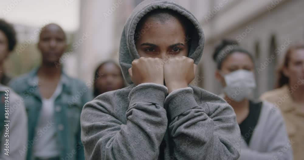 Group of social activists protesting silently. Woman in hooded shirt ...