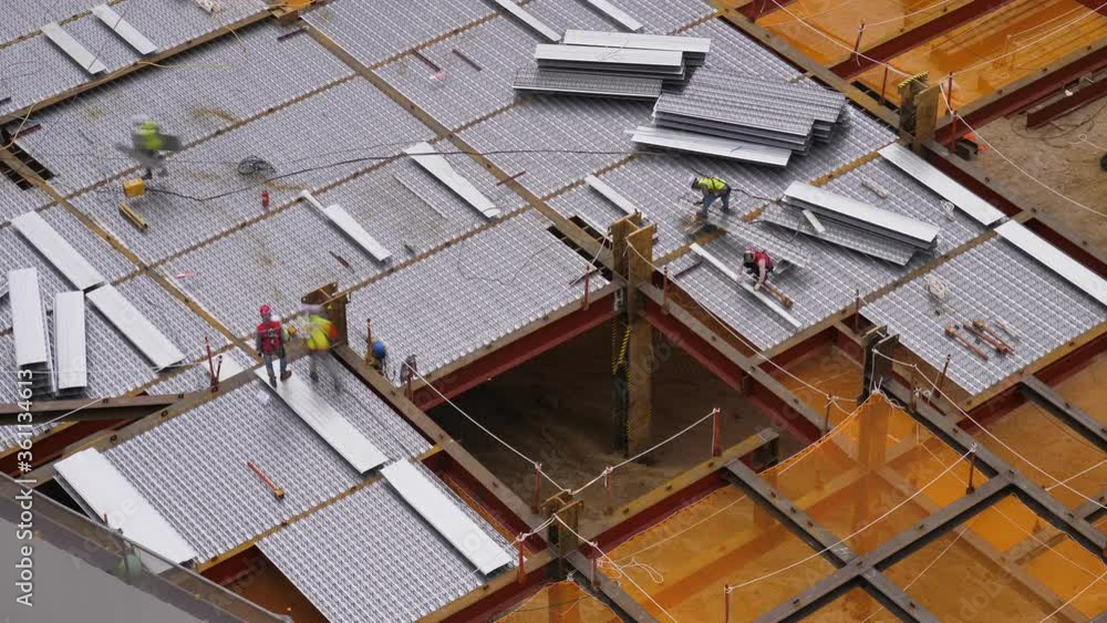 Permanent formwork placement on steel frame, time lapse shot of ...