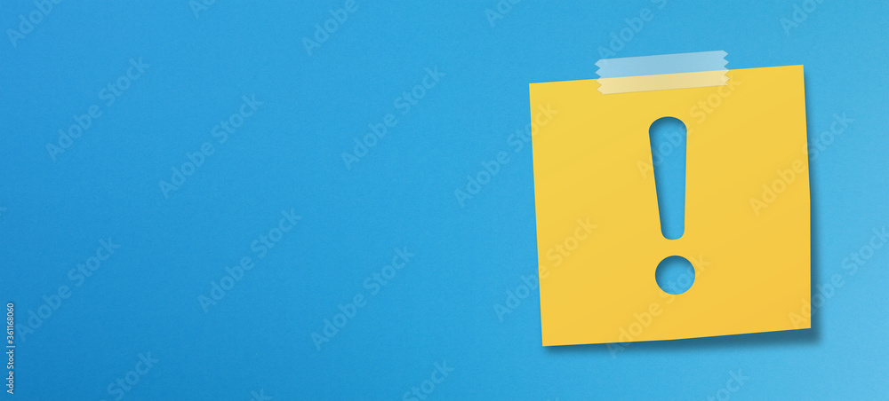 Yellow sticky note paper with exclamation mark on blue background Stock ...