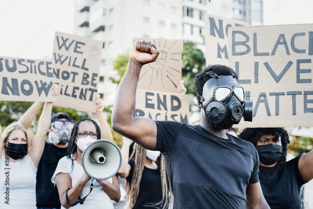 Activist wearing gas mask protesting against racism and fighting for ...