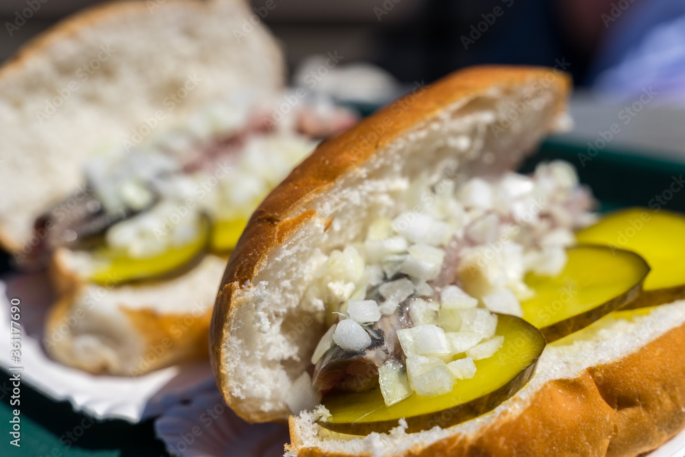 Typical traditional dutch herring sandwich close up macro shot with ... Typical traditional dutch herring sandwich close up macro shot with ...