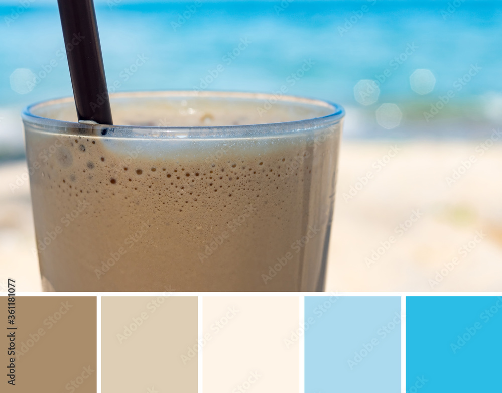 Brown cold coffee ice milk chocolate frappe drink on blurred beige ...