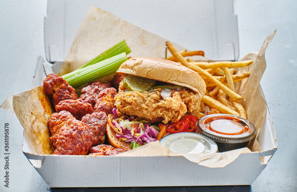 take out box with fried chicken sandwich, boneless wings and french ...