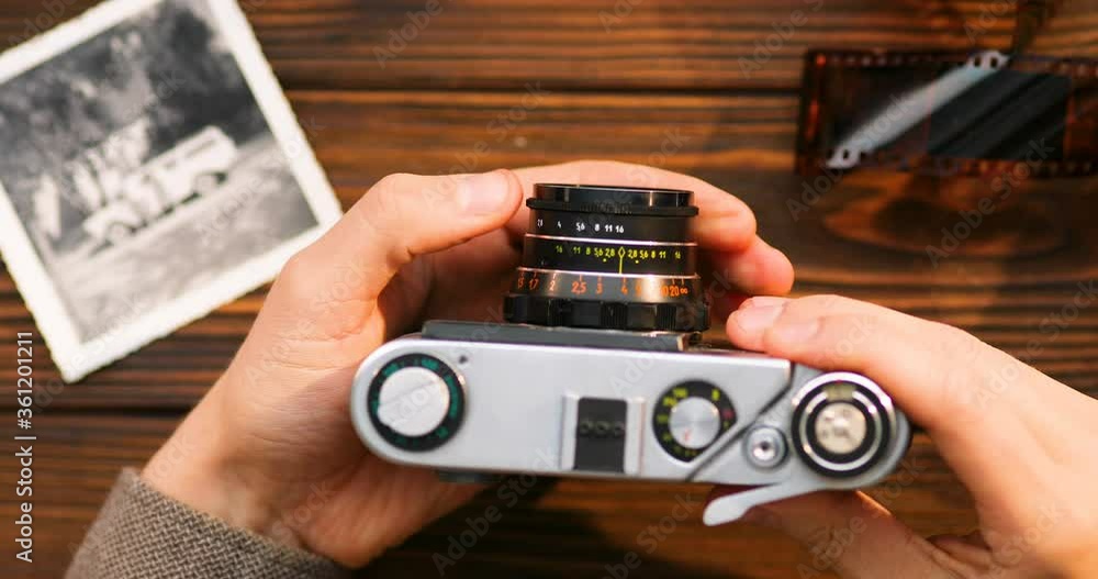 Close up of Caucasian male hands holding old vintage photo camera and ...