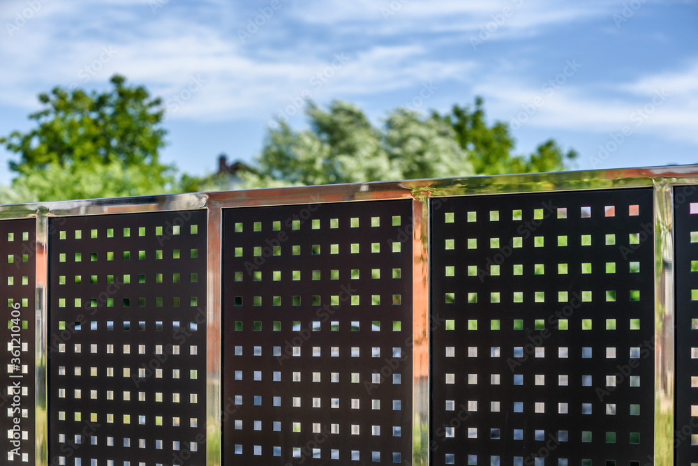 Perforated Metal Fence. Metal sheet panel fence Stock Photo | Adobe Stock