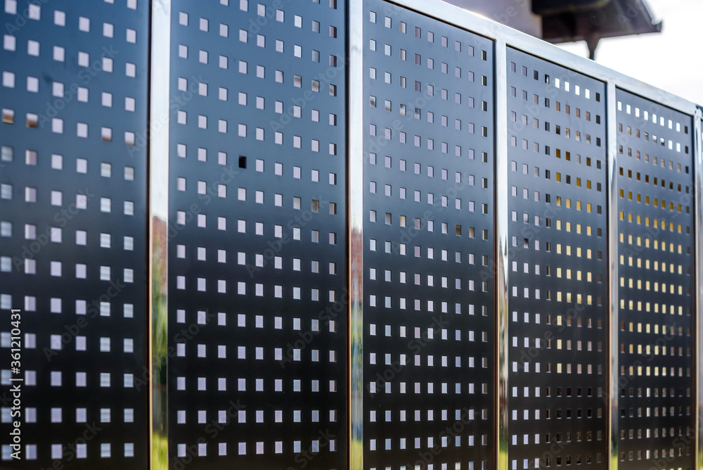 Perforated Metal Fence. Metal sheet panel fence Stock Photo | Adobe Stock
