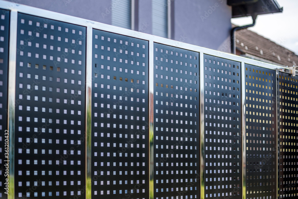 Perforated Metal Fence. Metal sheet panel fence Stock Photo | Adobe Stock