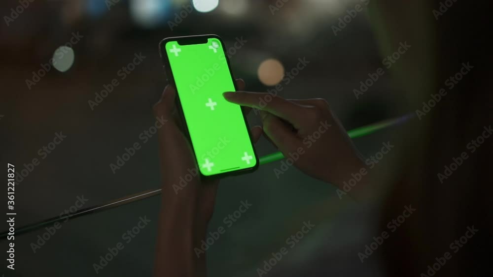 HD Slow motion of young Asian woman hand holding green screen ...