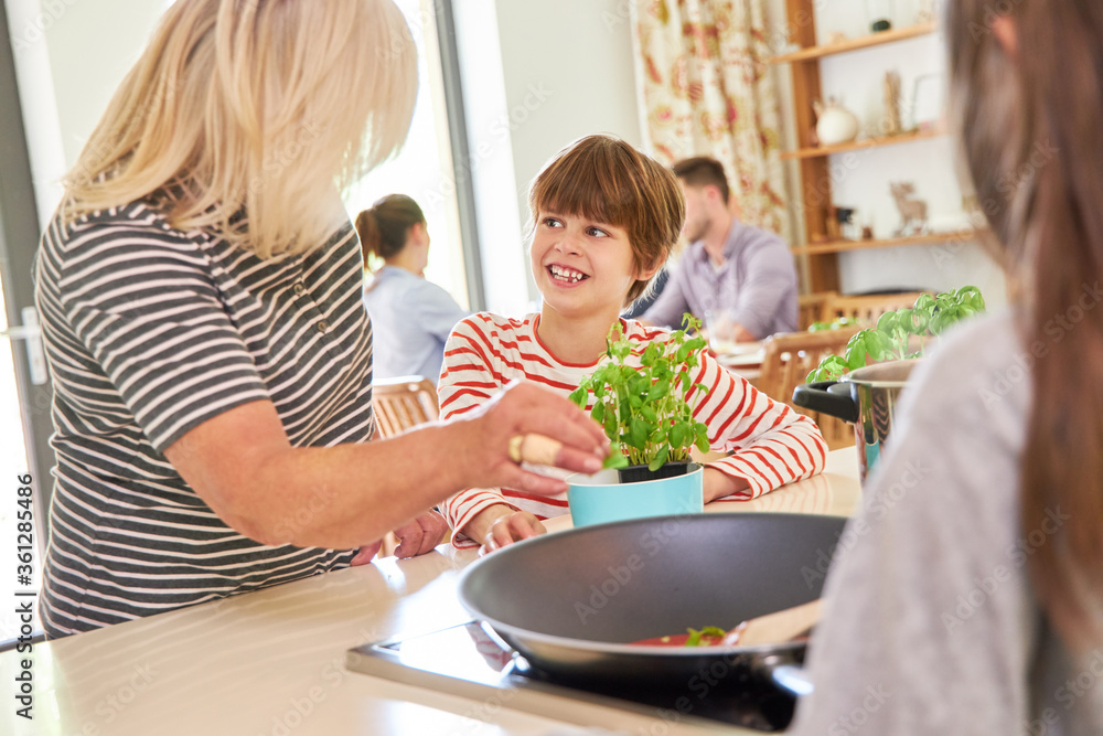 Grandma and kids cooking with herbs Stock Photo | Adobe Stock