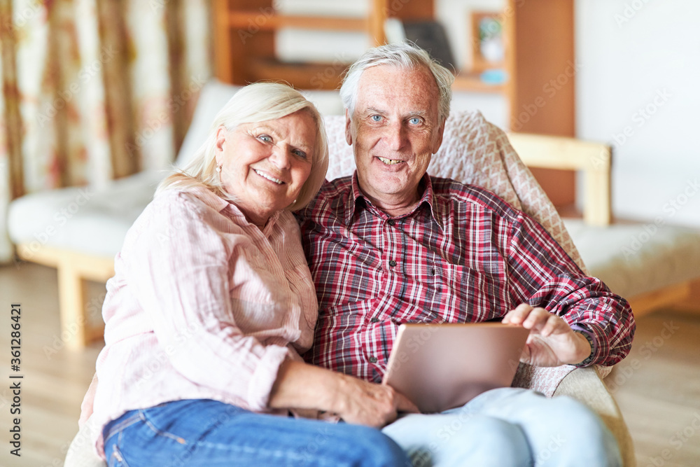 Happy retired couple retired with tablet Stock Photo | Adobe Stock