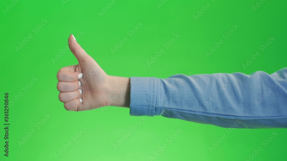Thumbs up sign hand gesture on green screen. Simbol of approval like ...