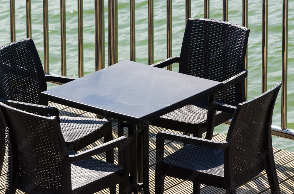 A SEASIDE CAFE - Tables for a seaside restaurant on the promenade with ...