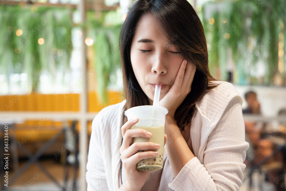 happy young asian woman drinking boba milk tea, bubble milk tea, pearl ...