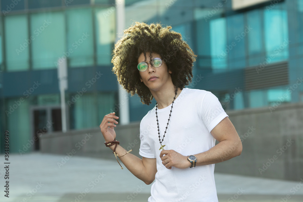 Arabian male model looking young guy looking to camera. Man with Curly ...