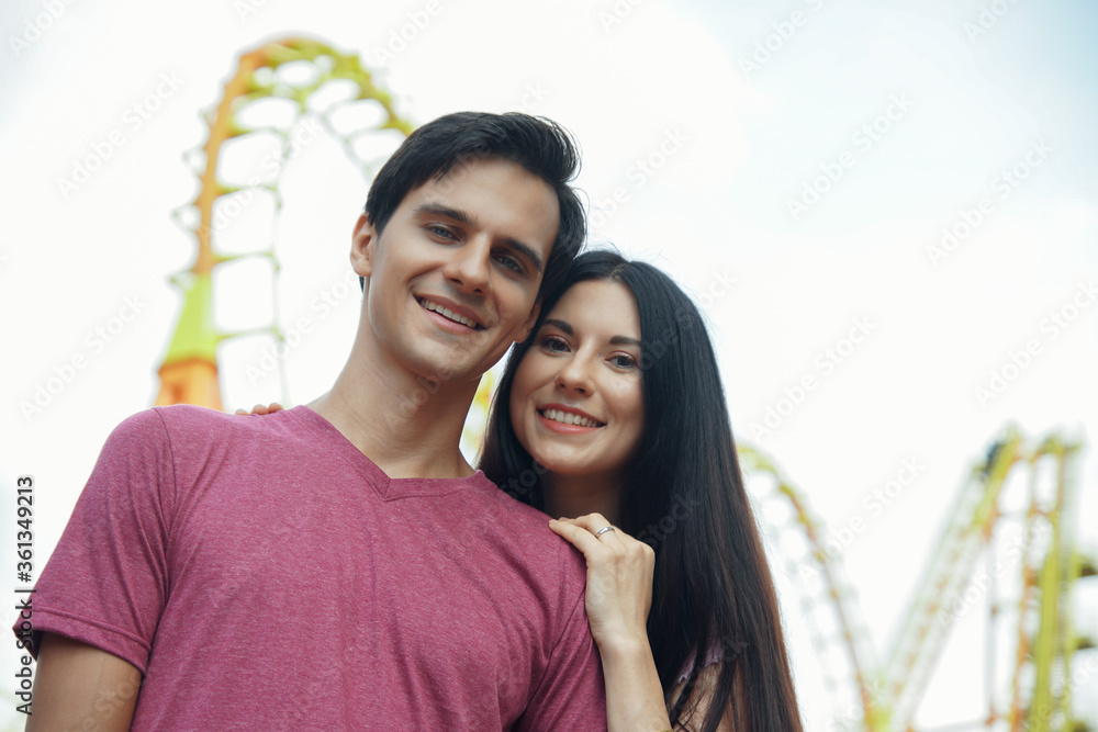 Happy Caucasian young couples taking photos together at theme park on ...