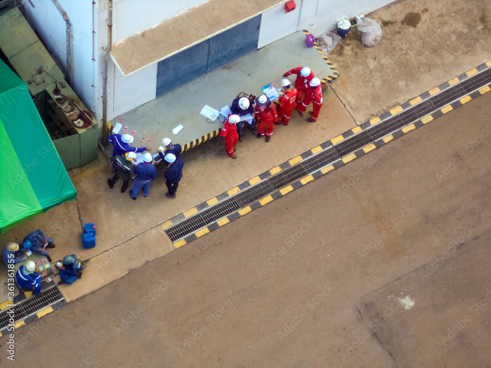 High building construction site with workers and steel bars.Group of ...