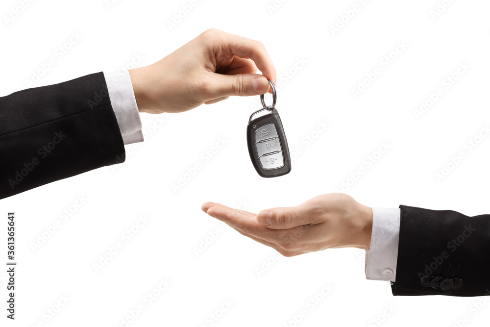 Male hand in a suit giving car keys to another male hand Stock Photo ...