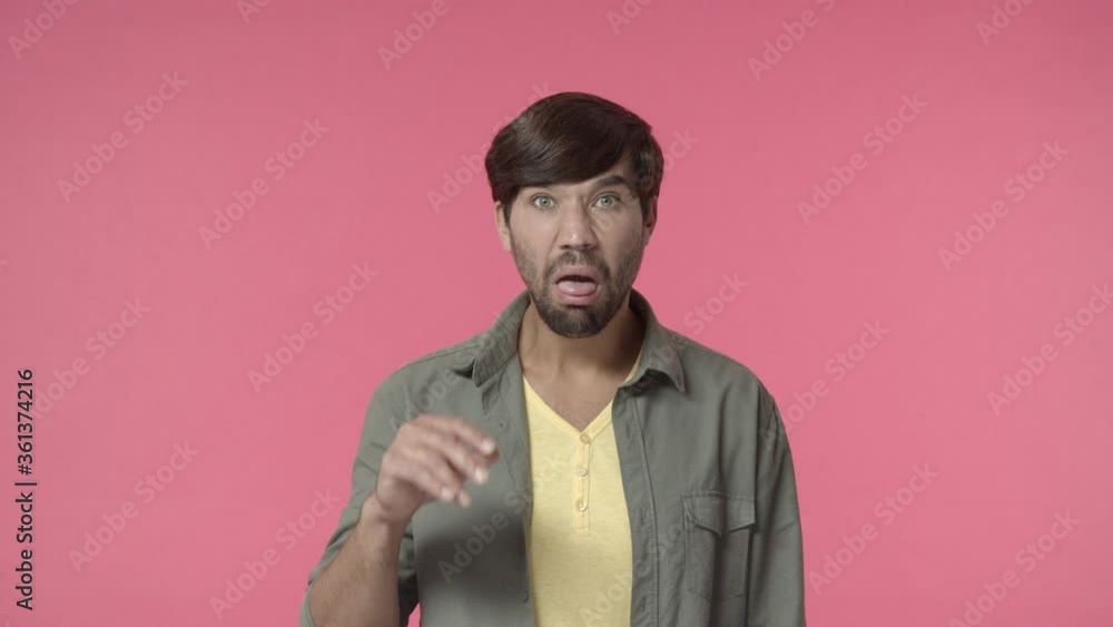 Annoyed and bored, rude young man mocking over boring person, mumbling ...