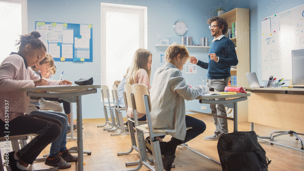 Enthusiastic Teacher Explains Lesson to a Classroom Full of Diverse ...