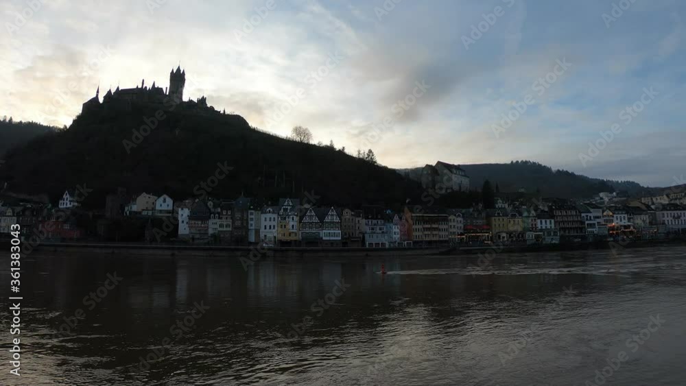 PAN SLOW MOTION SHOT - The town of Cochem, Germany, in the winter, with ...