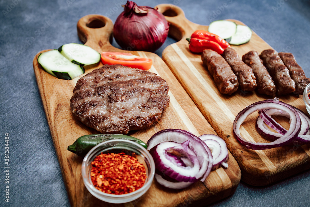 Wooden kitchen board with grilled meat, Turkish cevap and burger Stock ...