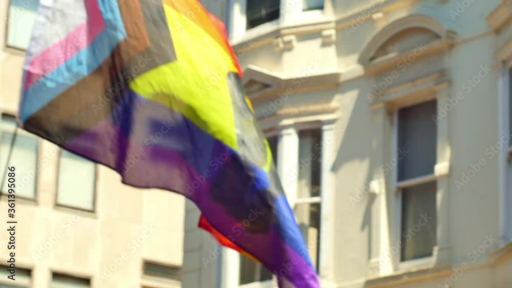 LGBTQ+ Progress pride flag with a black clenched raised fist in the ...