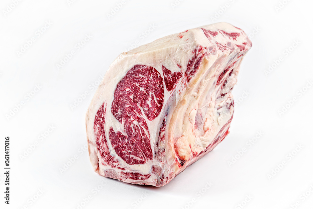 Raw dry aged wagyu cote de boeuf beef block as closeup on white ...