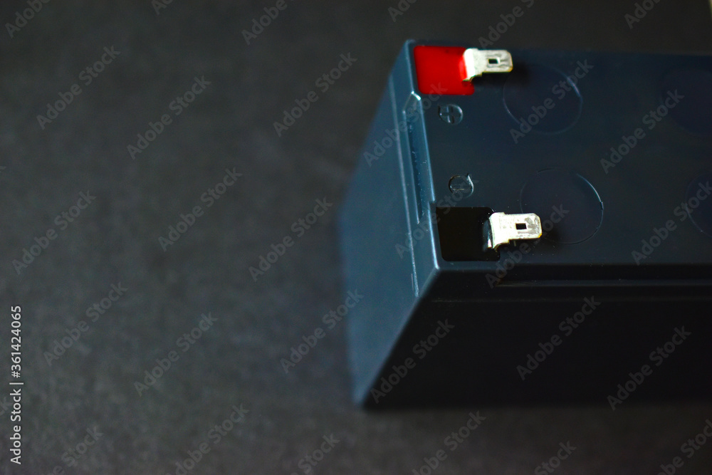 Lead battery from an uninterruptible power supply on a black background ...