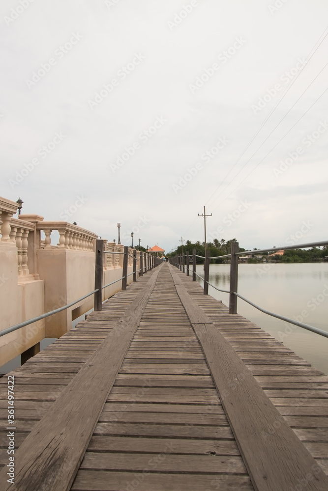 An old wooden bridge that stretches across Tak Bai River from the ...