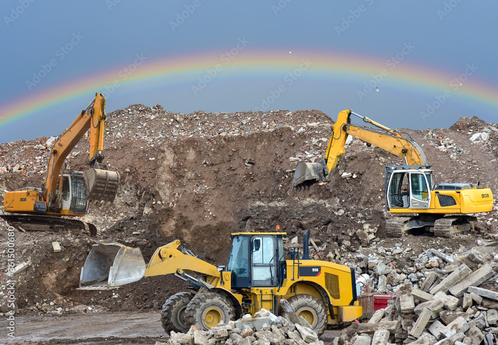 Front end loader and excavators at landfill for disposal of ...
