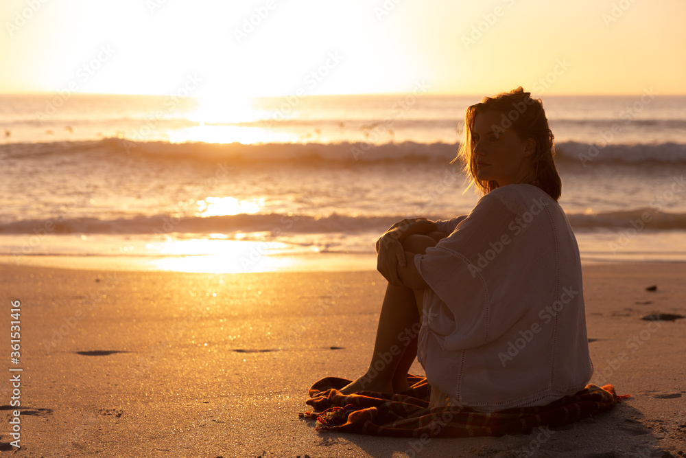 Girl Sitting On Beach Sunset